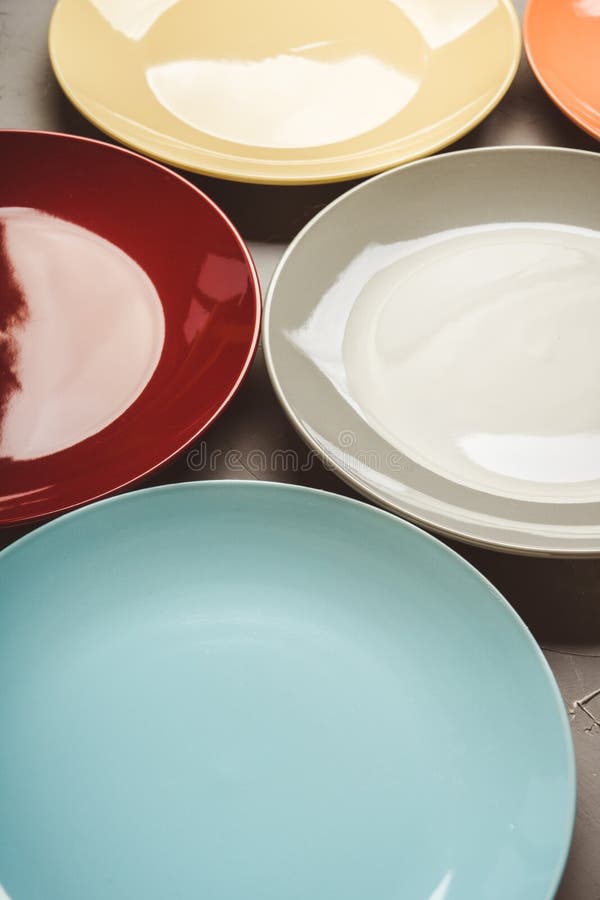 Clean Different Colour Plates on the Rustic Background Stock Photo ...