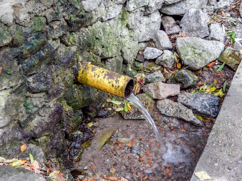 Clean Drinking Water Spring Flows from the Pipe Stock Photo - Image of ...