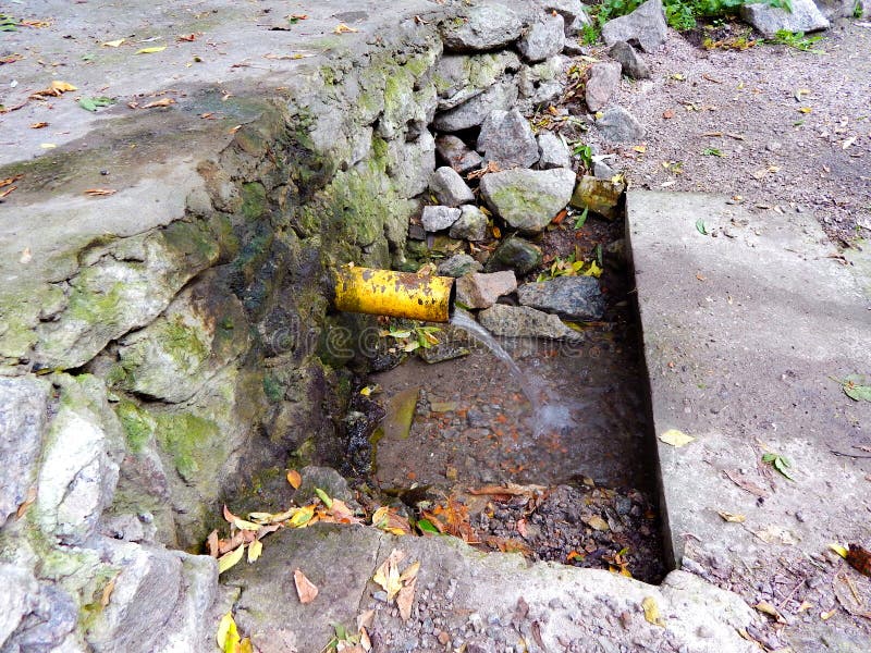 Clean Drinking Water Spring Flows from the Pipe Stock Photo - Image of ...