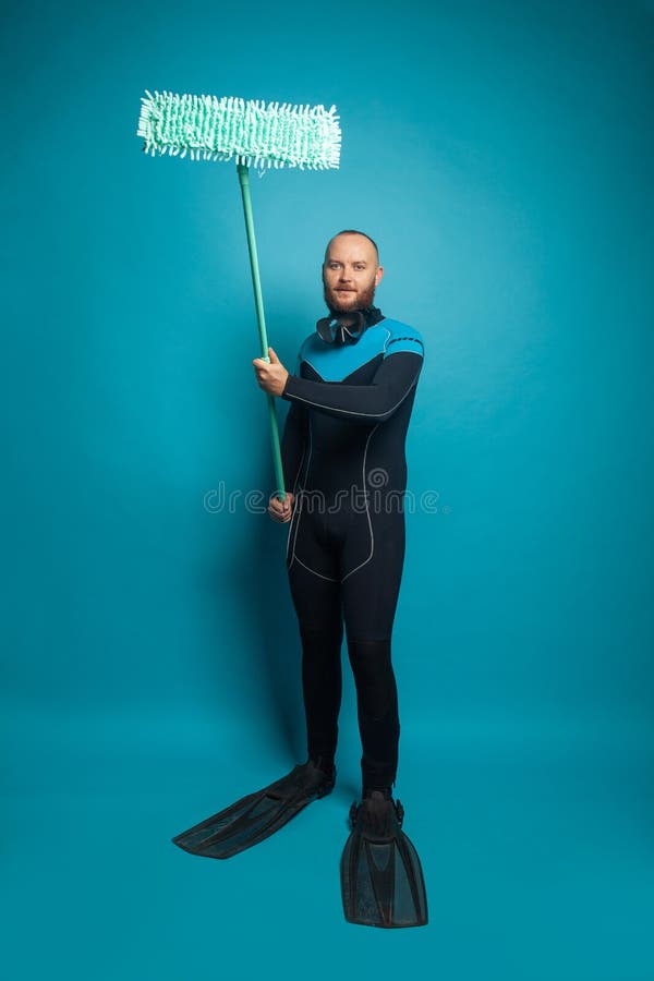 Clean and Environmental Protection Concept. Diver with Mop on Blue ...