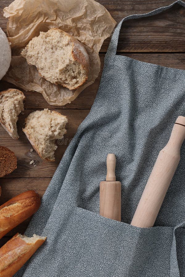 Clean Kitchen Apron with Rolling Pins and Different Types of Bread on ...