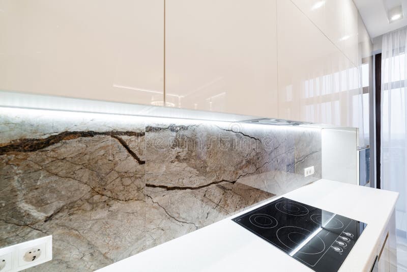 Clean and Kitchen with Light Furniture and White Countertop Stock Photo ...