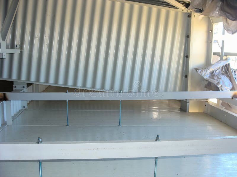 A Clean, Low-angle View of a White Metal Framework with Corrugated ...