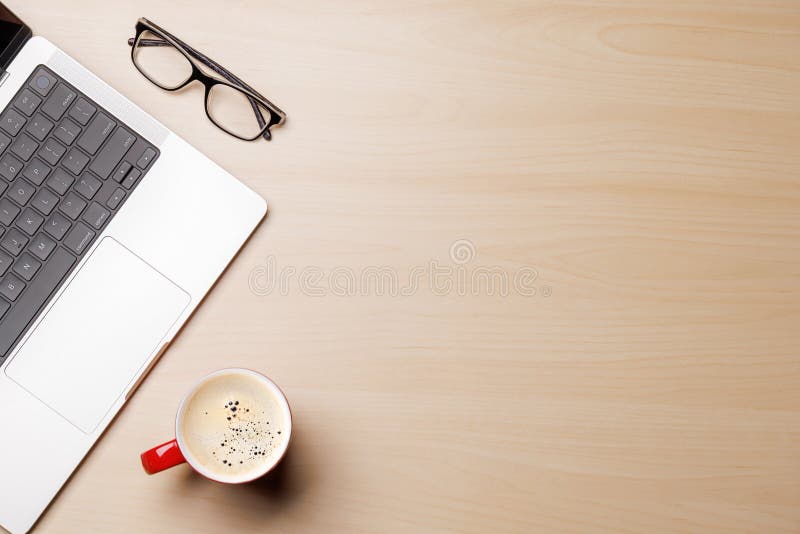 A Clean and Minimal Desk Setup Featuring a Laptop and a Coffee Cup ...