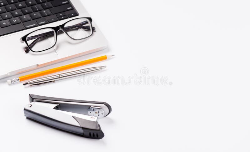 A Clean and Minimal Desk Setup Featuring a Laptop and a Office Supplies ...