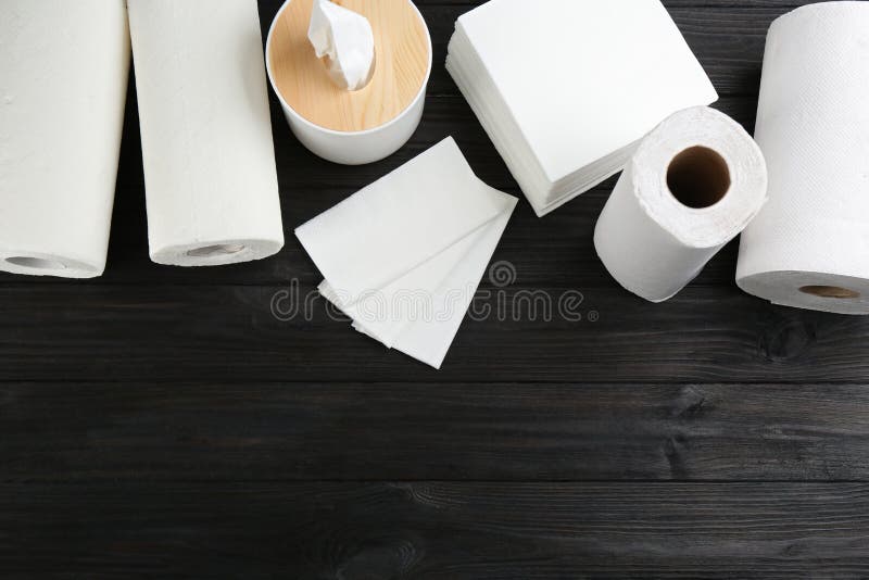 Clean Napkins, Box with Tissues and Rolls of Paper Towels on Wooden ...