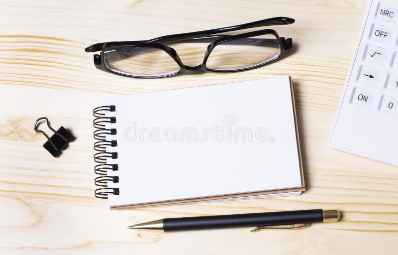 A Clean Notebook with a Pen is Lying on a Wooden Office Table. Top View ...