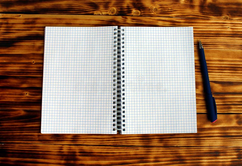Clean Open Checked Notebook with Blue Pen Stock Photo - Image of ...