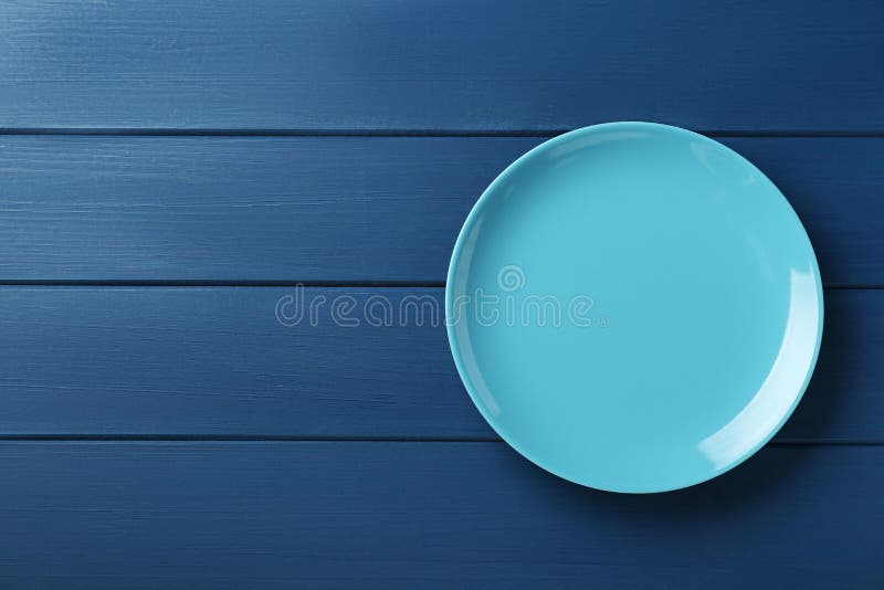 Clean Plate on Wooden Blue Table, Top View. Space for Text Stock Photo ...