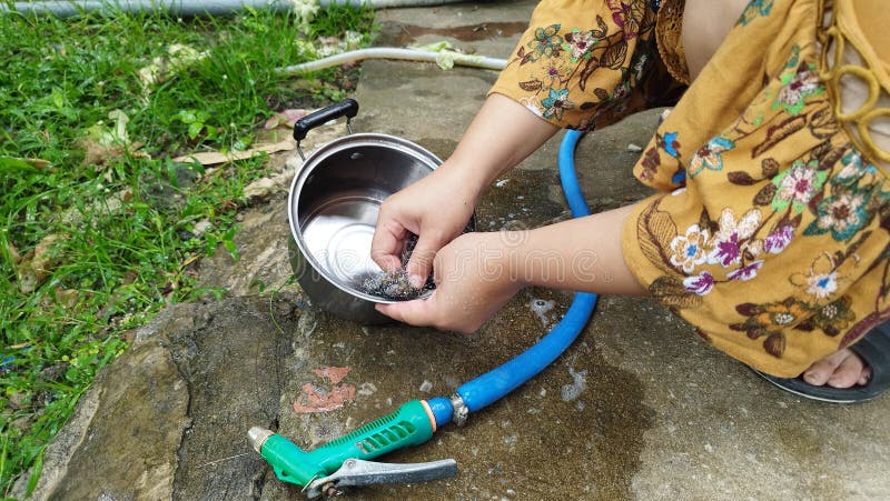 Clean the Pot with a Pot Scrubber Stock Photo - Image of scrubber ...