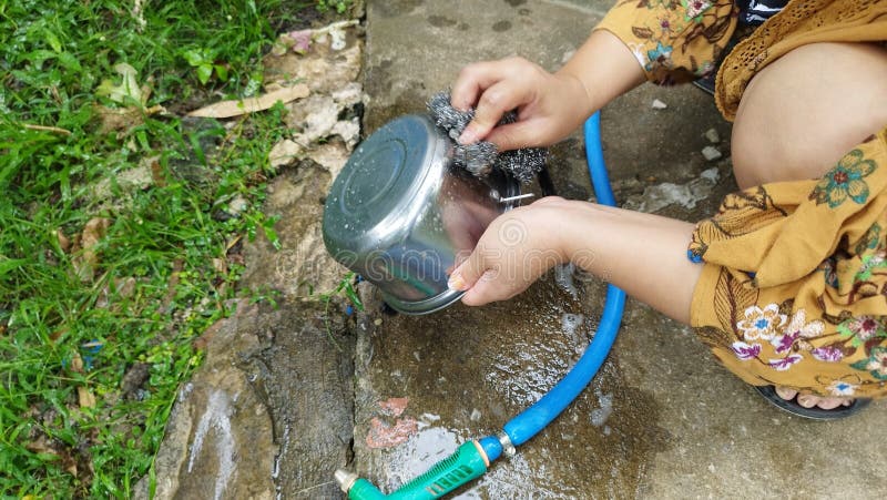 Clean the Pot with a Pot Scrubber Stock Photo - Image of kitchen ...