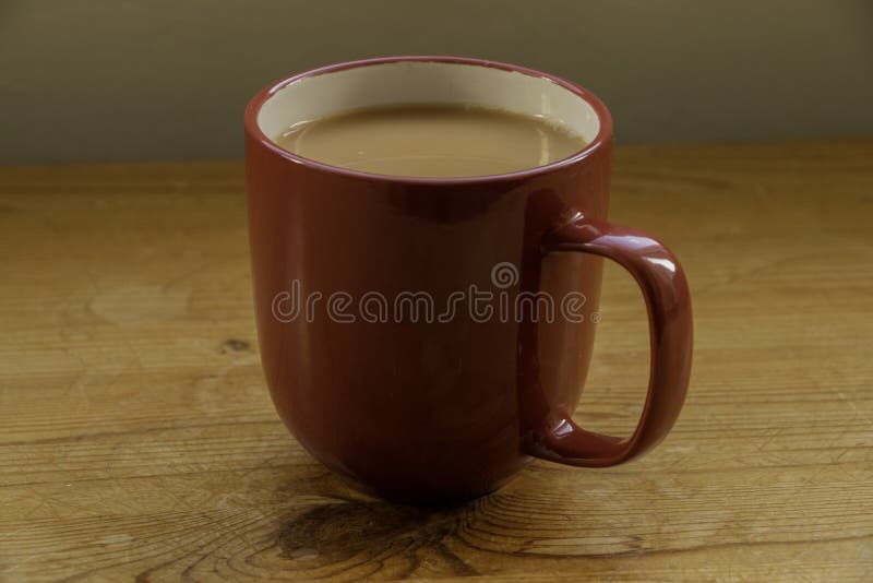 A red cup tea of tea stock photo. Image of brew, wooden - 142012110