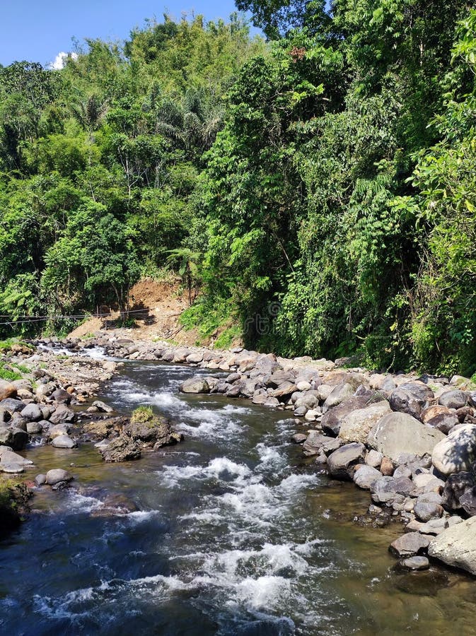 A Clean River Combined with Rocks and Beautiful Scenery Stock Photo ...