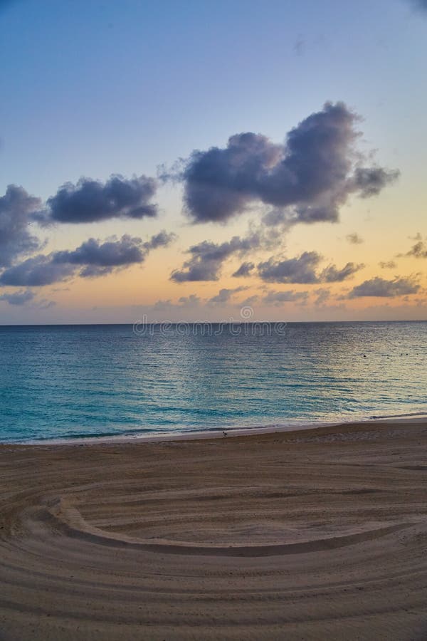 Clean Sandy Beach and Blue Ocean with Soft Sky during Sunset Stock ...