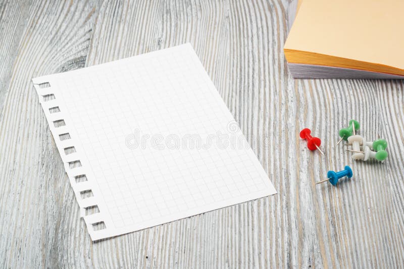 Clean Sheet in Cell from Notebook on Rustic Table. Stationery Stock ...