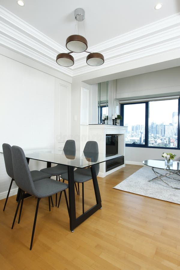 Clean and Simple Dining Table with Lighting Fixture in a Modern ...
