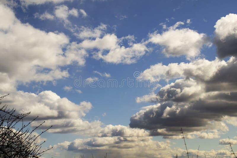 Clean Sky with Air Fluffy Clouds and Sun Behind the Cloud on Sunset As ...