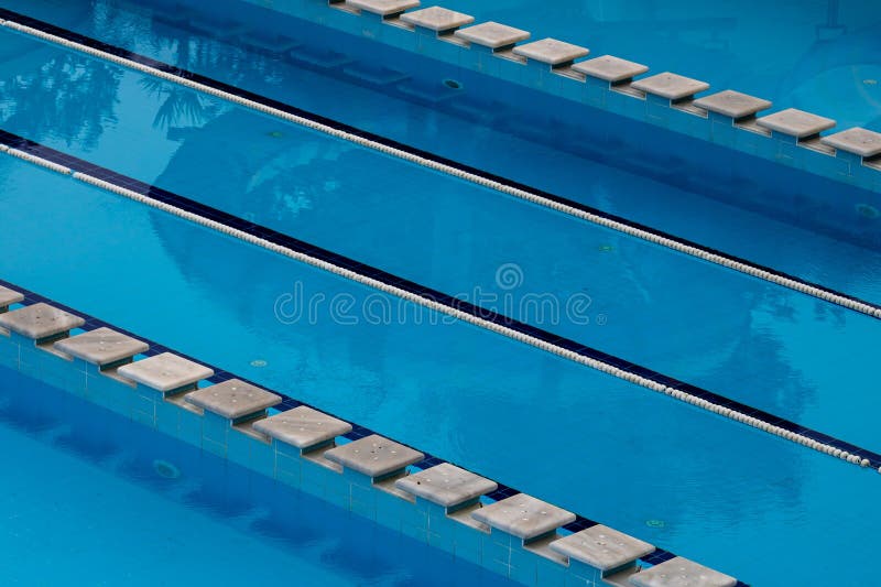 Clean Swimming Pool with Clear Blue Water, Bordered by White Tiles ...