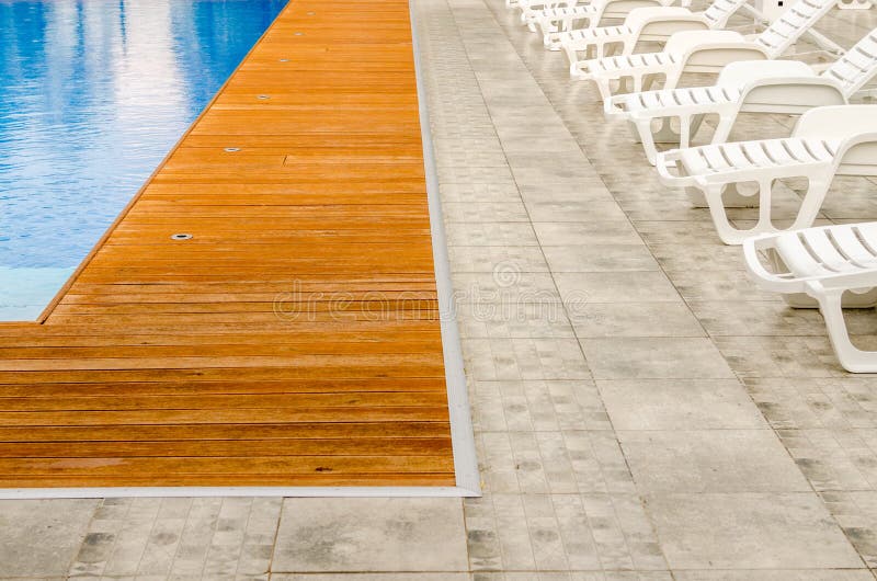 Clean Swimming Pool and Empty Resting Chair Stock Image - Image of ...
