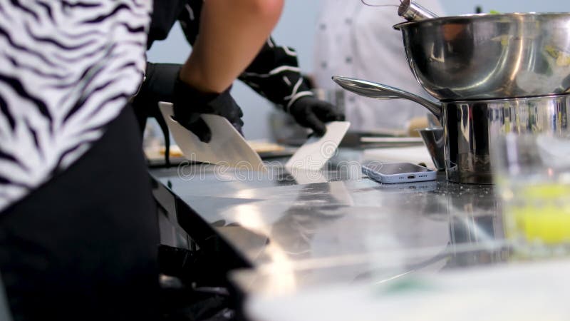 Cleaning the Table in a Production Kitchen. Clean the Table Wipe Table ...
