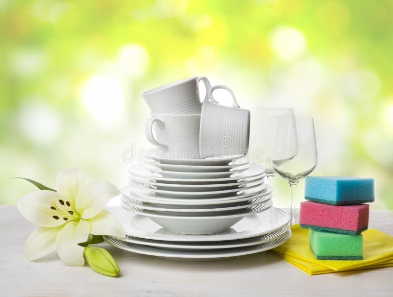 Clean Tableware, Dishwashing Sponges and Lily Flower Over Abstract ...