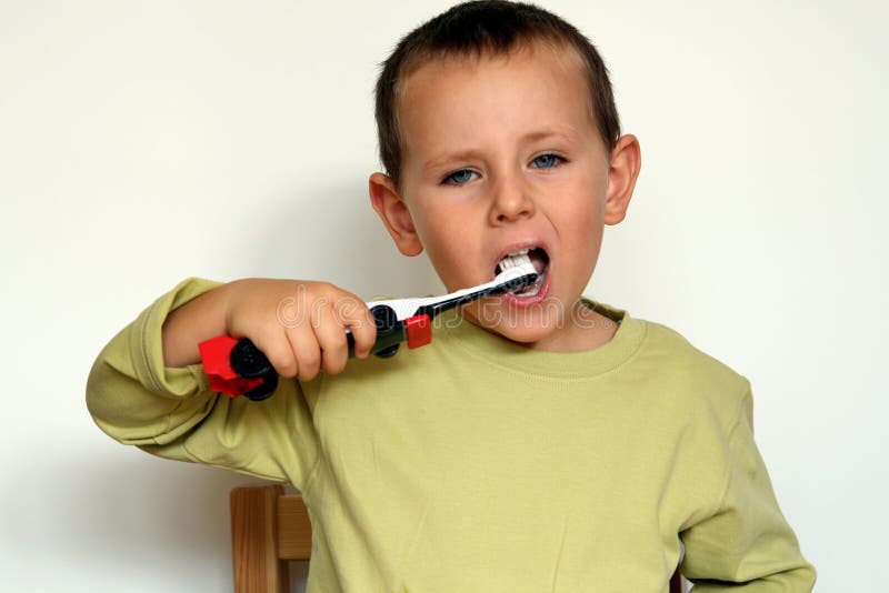 Teenage Boy Brushing Teeth stock photo. Image of diverse - 26764860