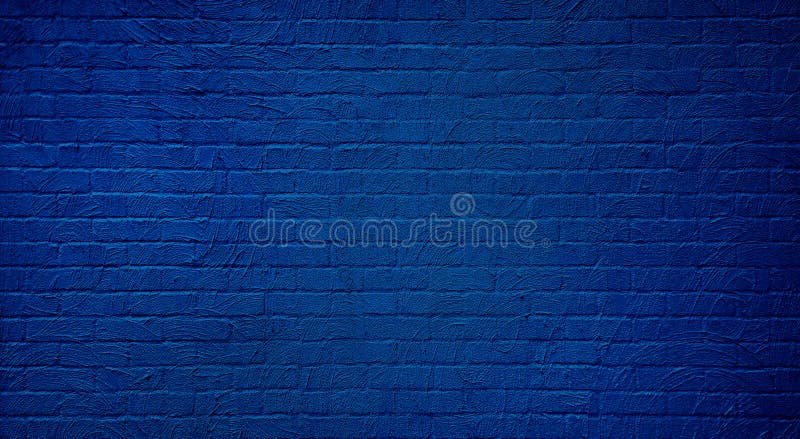 A Clean, Textured Blue Plaster Brick Wall Provides a Neutral and ...