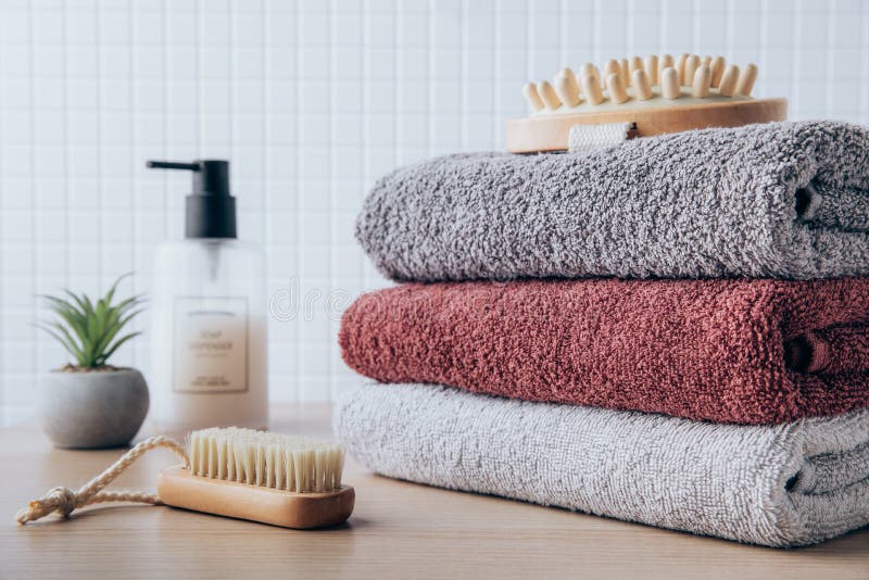 Towels. Clean Fresh Fluffy Towels and Bath Accessories on Table in ...
