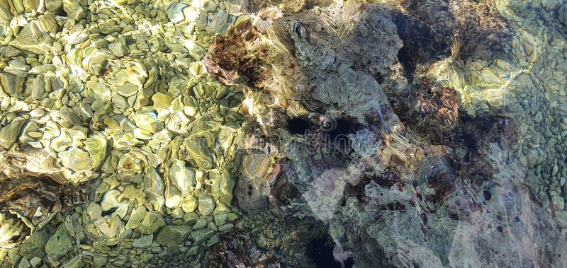 Clean Water in the Ocean and Rocks Whit Sun Rays Stock Photo - Image of ...