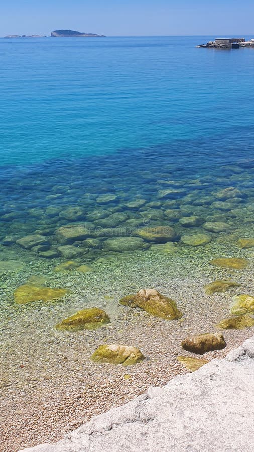 Clean water and rocks stock photo. Image of coral, terrain - 252075082