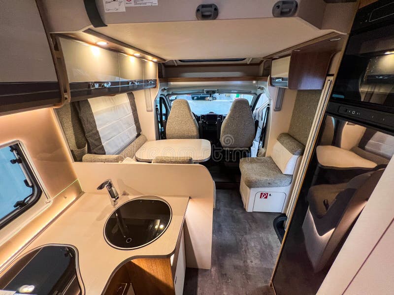 Clean, Well-lit Interior of a Modern Camper Van, Featuring a Compact ...