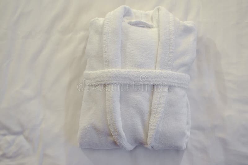 Clean Folded Bathrobe on White Bed. Stock Image - Image of beauty ...