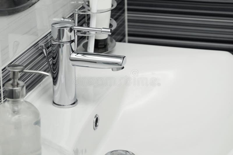 Clean White Sink with Shiny Water Tap in Bathroom Stock Image - Image ...