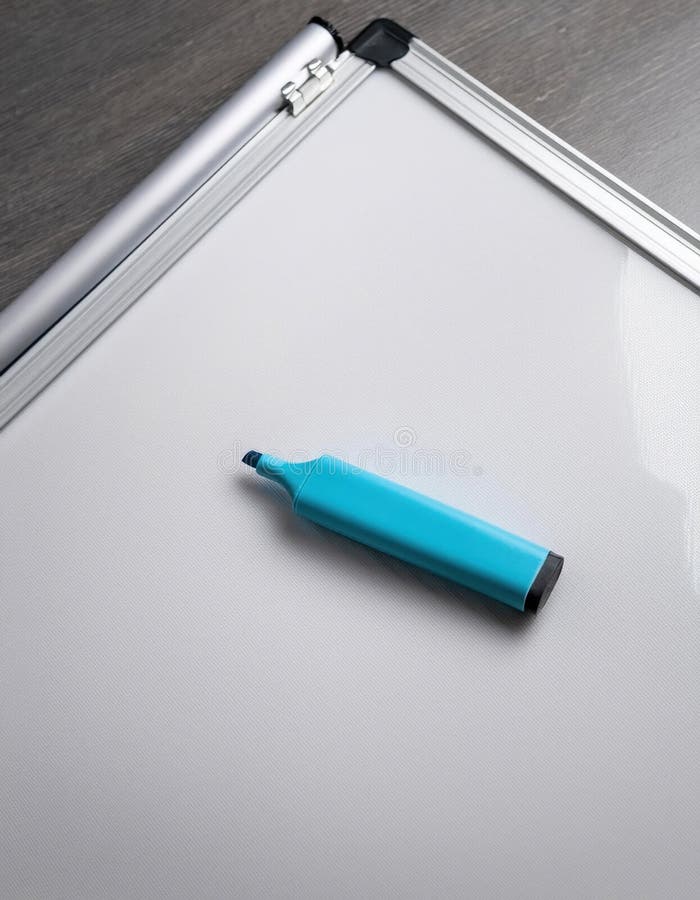 Clean Whiteboard Awaiting Ideas with a Blue Marker Resting at the ...