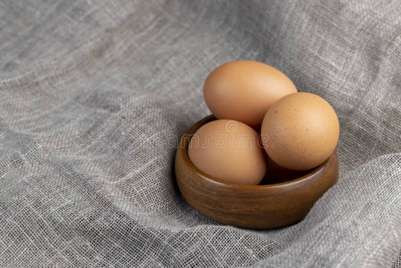 A Clean Whole Orange Chicken Egg Close-up on the Table Stock Image ...