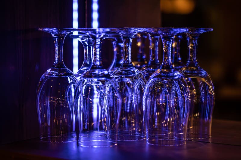 Clean Wine Glasses in the Night Bar Glowing with Neon Colors Stock ...