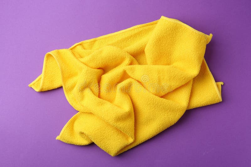 Clean Yellow Microfiber Cloth on Purple Background, Top View Stock ...