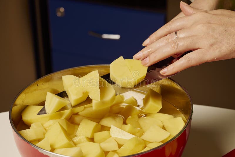Cleaned and cut potatoes stock photo. Image of fresh - 302855424