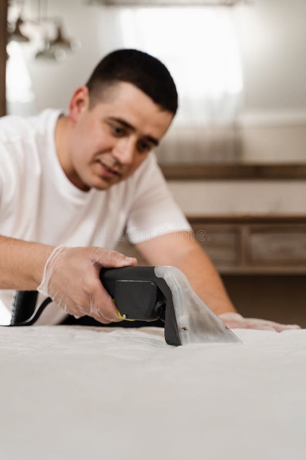 Cleaner is Extracting Dirt from Mattress Using Dry Cleaning Extractor ...