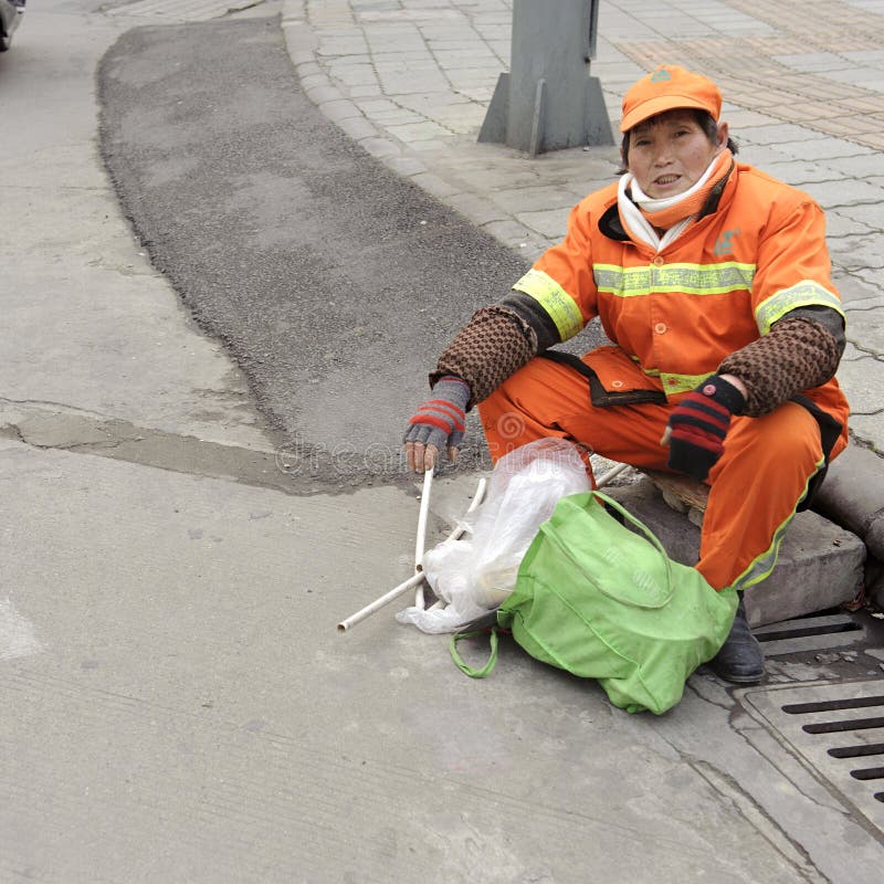 A Cleaner Sitting on the Roadside To Rest Editorial Image - Image of ...