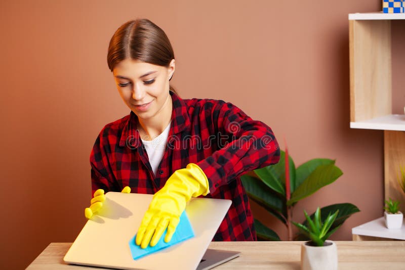 Cleaner Tidies Up the Computer Desk in the Office Stock Photo - Image ...