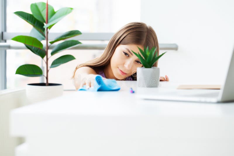 Cleaner Tidies Up the Computer Desk in the Office Stock Photo - Image ...