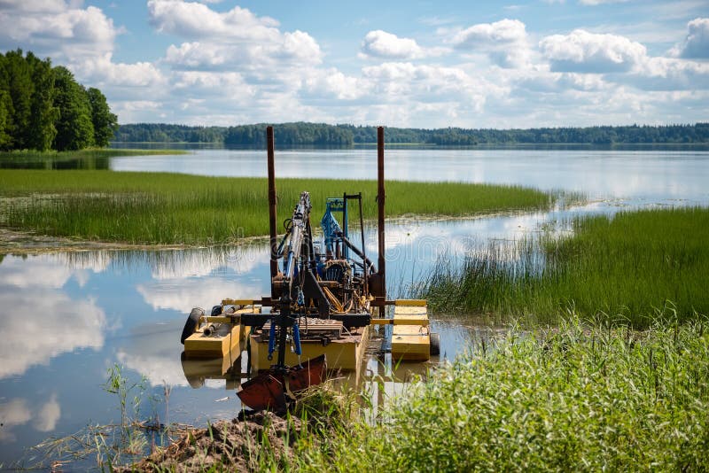 Clean up the lake stock image. Image of engineering - 113883893