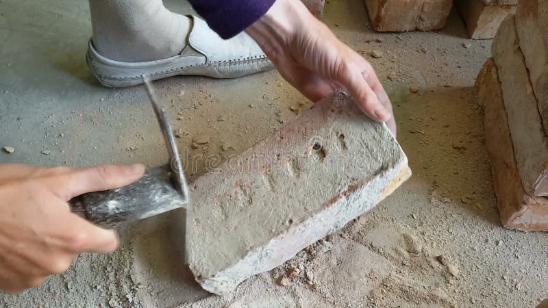 Cleaning bricks for reuse stock video. Video of bricklayer - 77970541