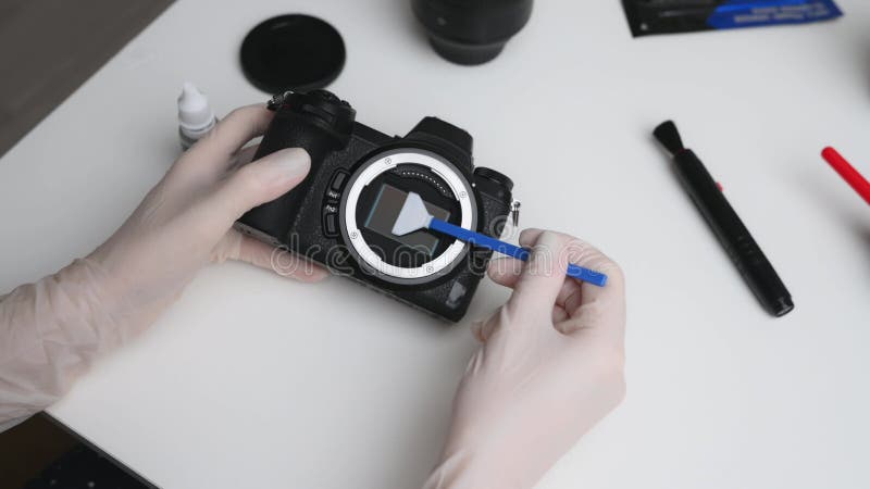 Cleaning the Camera Sensor with Sensor Cleaning Swab from Dust and Dirt ...