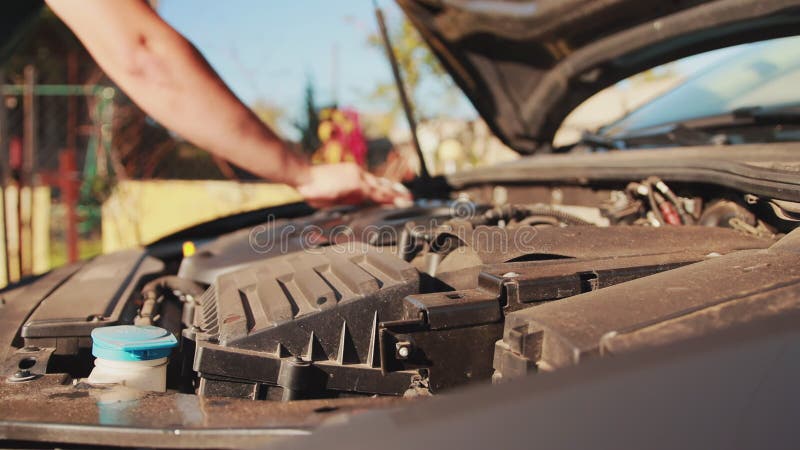 Cleaning the Car Engine Compartment from Dirt with Wet Wipes. Caring ...