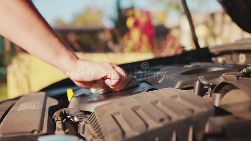 Cleaning the Car Engine Compartment from Dirt with Wet Wipes. Caring ...