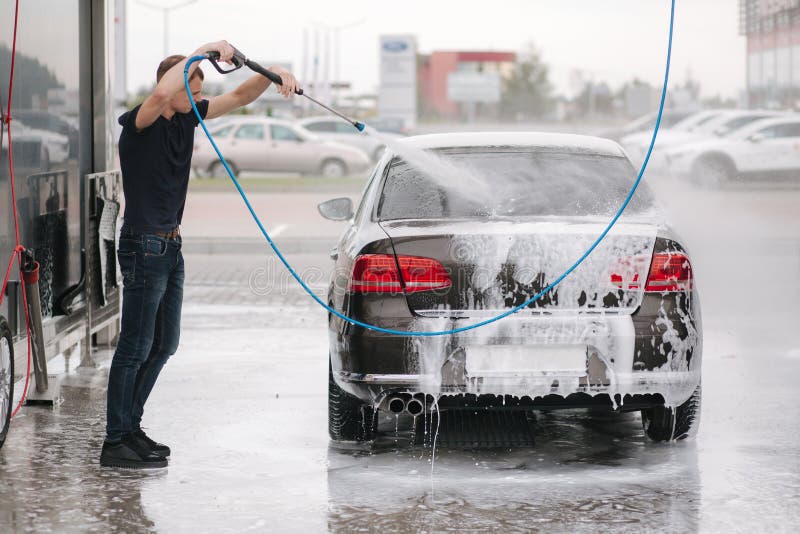 Cleaning Car Using Active Foam. Man Washing His Car on Self Car-washing ...