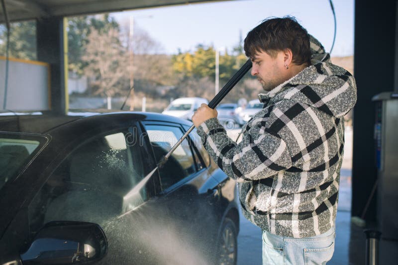 Cleaning Car Using Active Foam. Man Washing His Car on Self Car-washing ...