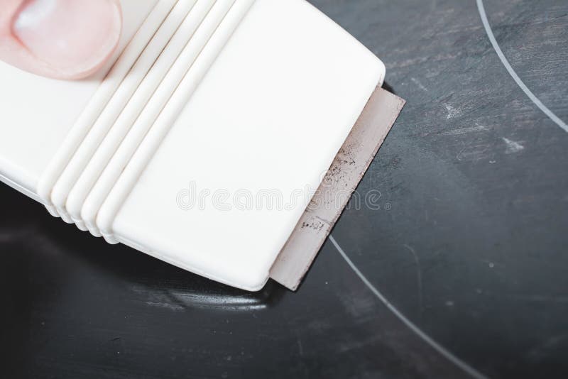 Cleaning a Ceramic Glass Cooktop with a Glass Scraper Stock Image ...